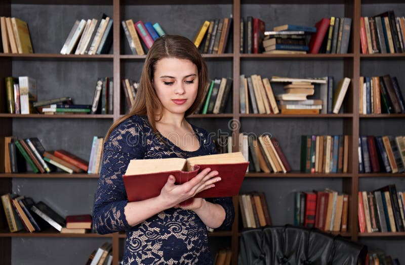 Woman in the library stock photo. Image of bookshelf - 67514200