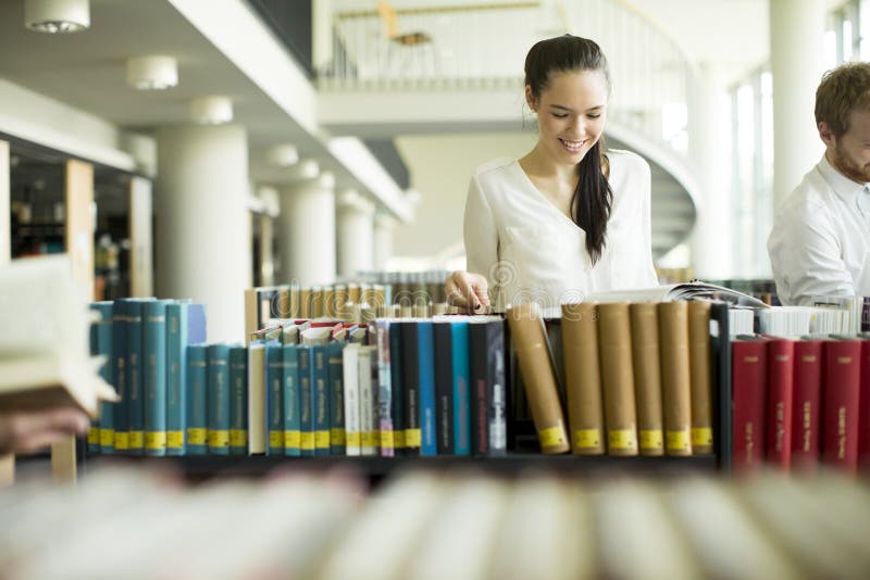 Woman in the library stock photo. Image of bookstore - 72065428