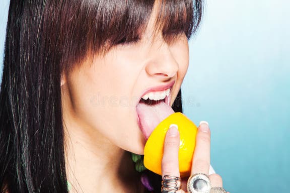 Woman lick lemon stock image. Image of fresh, natural - 23887967