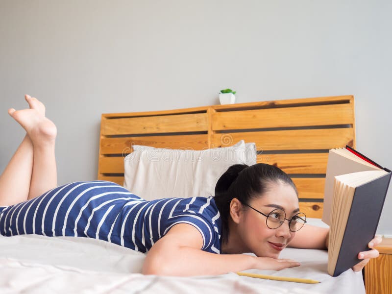 Woman Lie on Bed and Read Book. Stock Photo - Image of learning ...