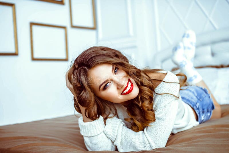 Woman lies on the bed stock photo. Image of female, beautiful - 93259880