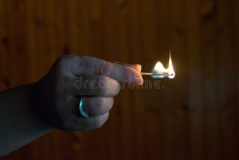 The Woman Lights a Match, Fire from a Match. Stock Photo - Image of ...