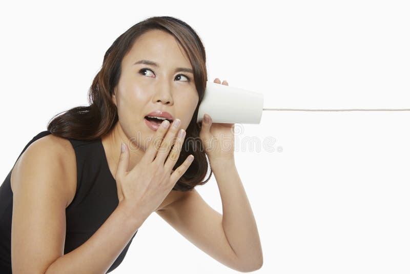 Woman Listening through a Cup Phone Stock Image - Image of expression ...