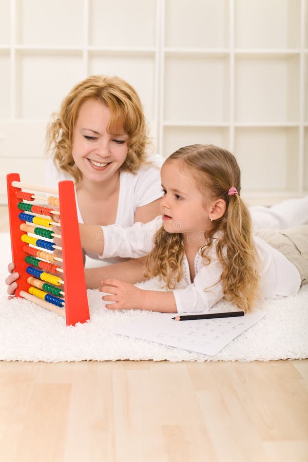 Woman and Little Girl Learning Math Together Stock Image - Image of ...