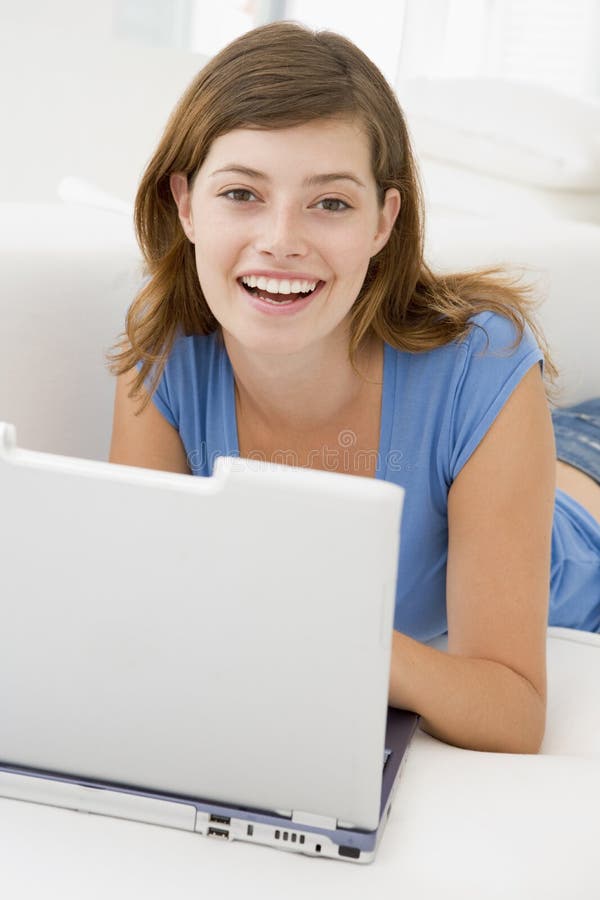 Pleased Woman Using Her Laptop Lying on the Floor Stock Image - Image ...