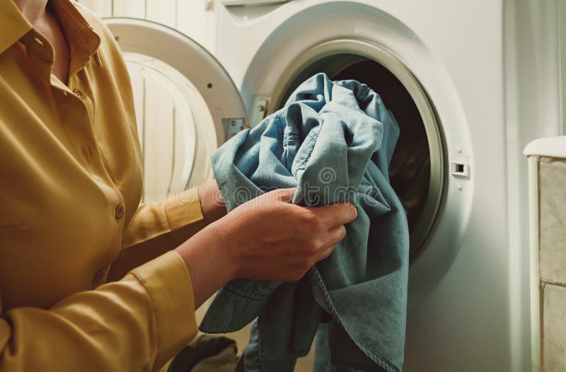 Loading Clothes into Washing Machine Stock Photo - Image of apparel ...