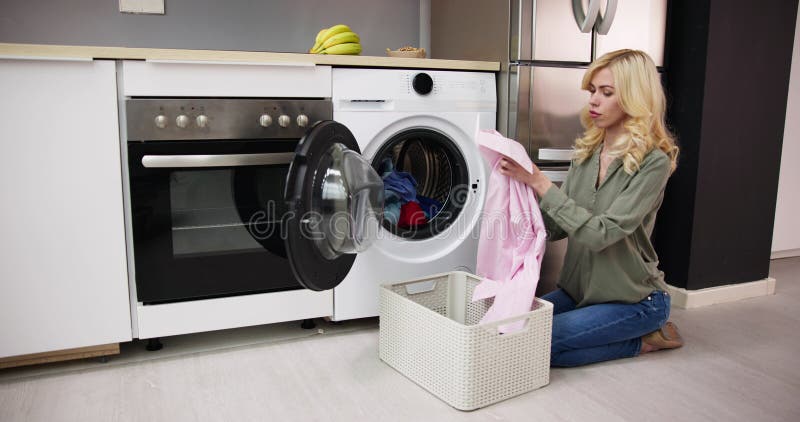 Woman Loading Dirty Clothes in Washing Machine for Washing Stock Image ...