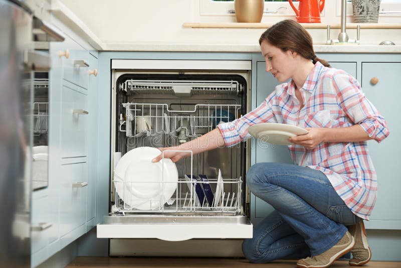 Woman Loading Dishwasher in Kitchen Stock Image - Image of loading ...