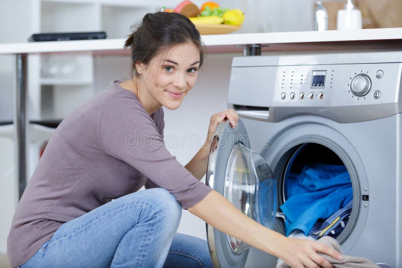 Woman Loading Washing Machine at Home Stock Photo - Image of appliance ...