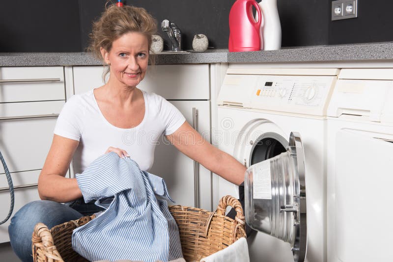 Woman Loading Washing Machine Stock Photo - Image of drying, agile ...
