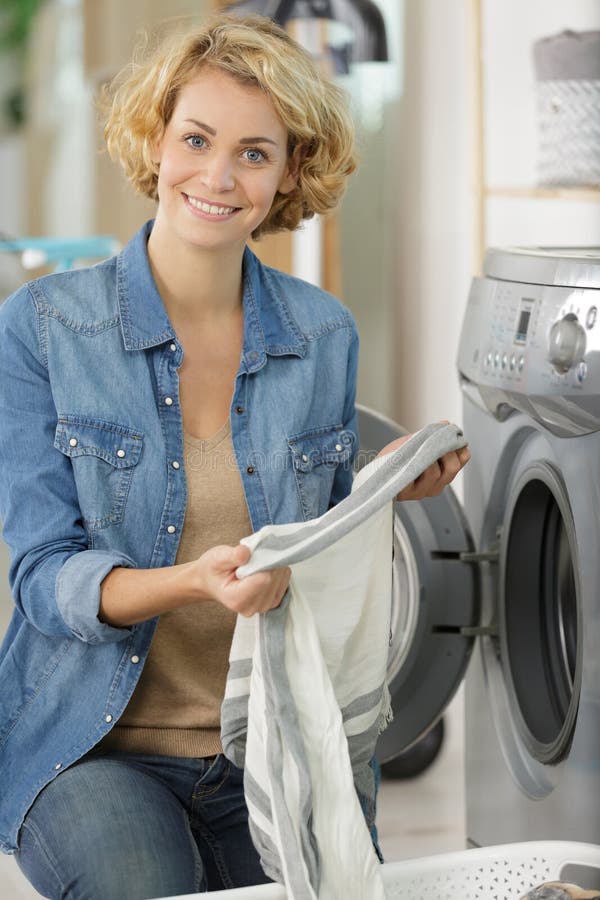 Woman Loading Washing Machine Stock Photo - Image of clean, casual ...