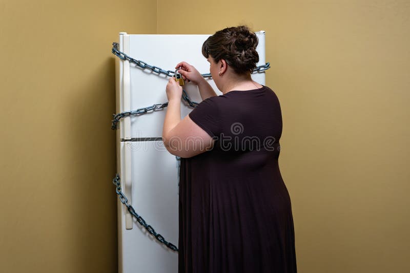 Woman Locks a Refrigerator with Chains. Ai Generated. Stock ...