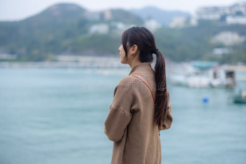 Woman look at sea stock image. Image of travel, water - 254640219