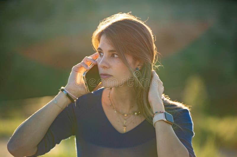 Woman Looking Away Talking Phone Outdoors Backlight Stock Photos - Free ...
