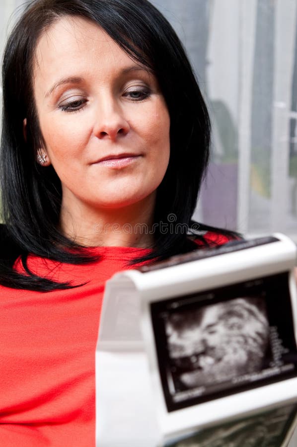 Woman Looking Over Paperwork Stock Image - Image of caucasian, works ...