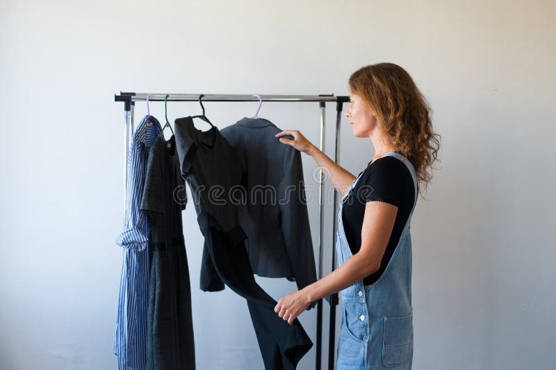 Woman Looking at Clothes. Young Shopping Fun Stock Image - Image of ...