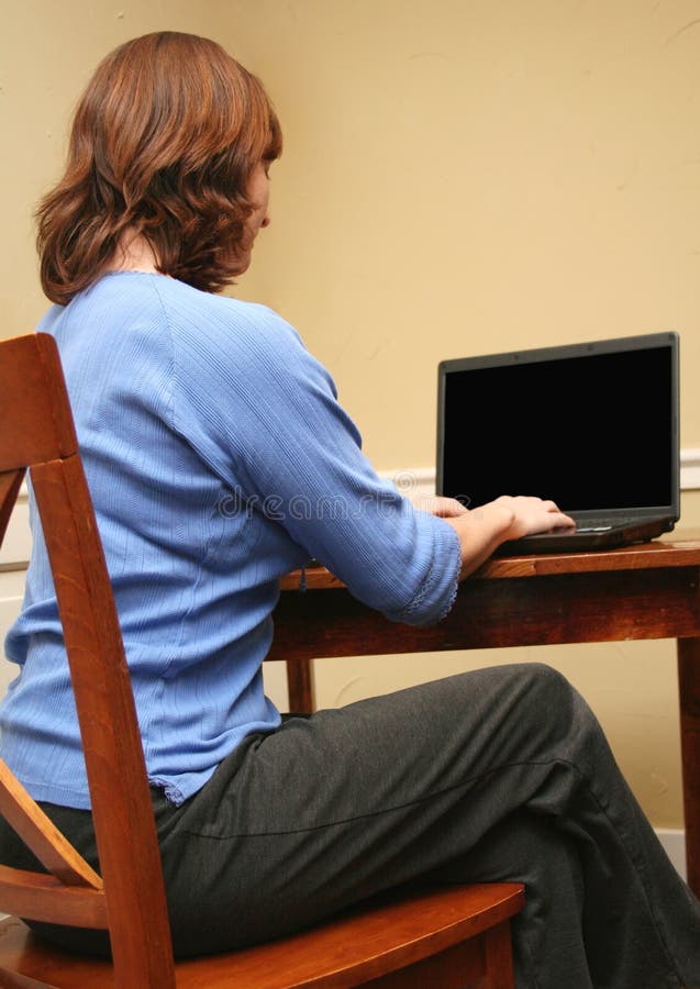 Woman Looking at Computer stock image. Image of casual - 7925221