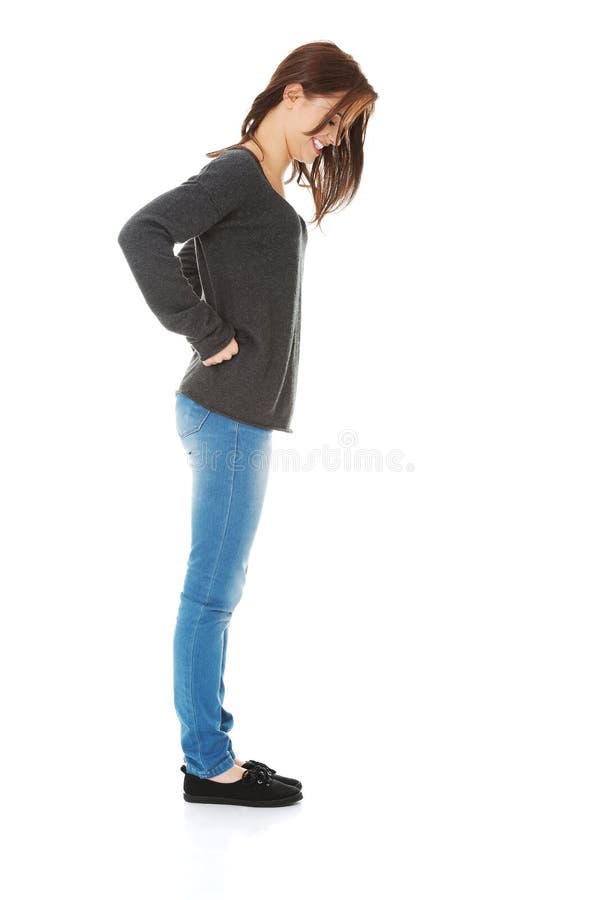 Attractive Young Woman Standing and Looking Down. Side View Stock Photo ... Attractive Young Woman Standing and Looking Down. Side View Stock Photo ...
