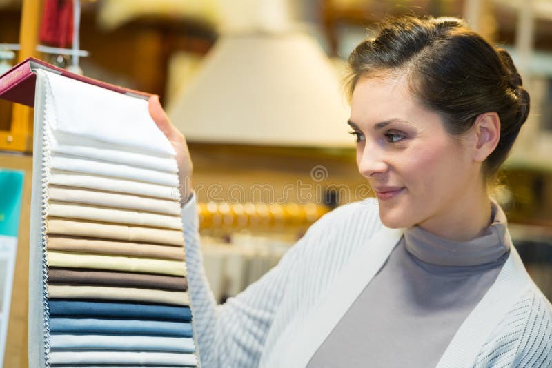 Woman Looking at Fabric Collection Sample Stock Image - Image of ...