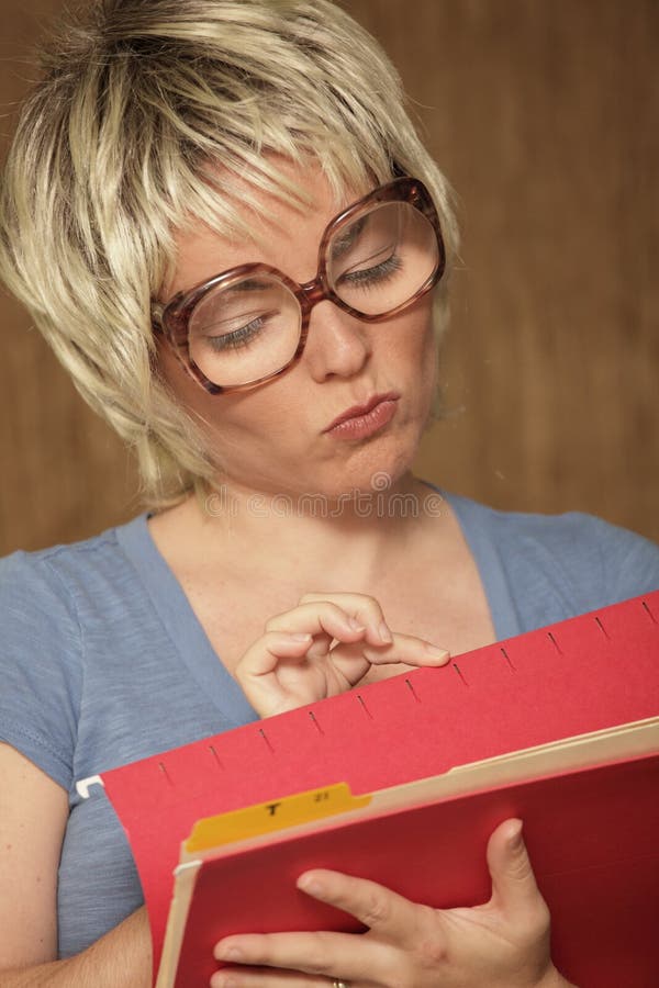 Woman Looking through Files Stock Image - Image of mature, file: 17567881
