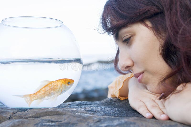 Woman Looking at a Fish in a Bowl Stock Photo - Image of stare, fauna ...