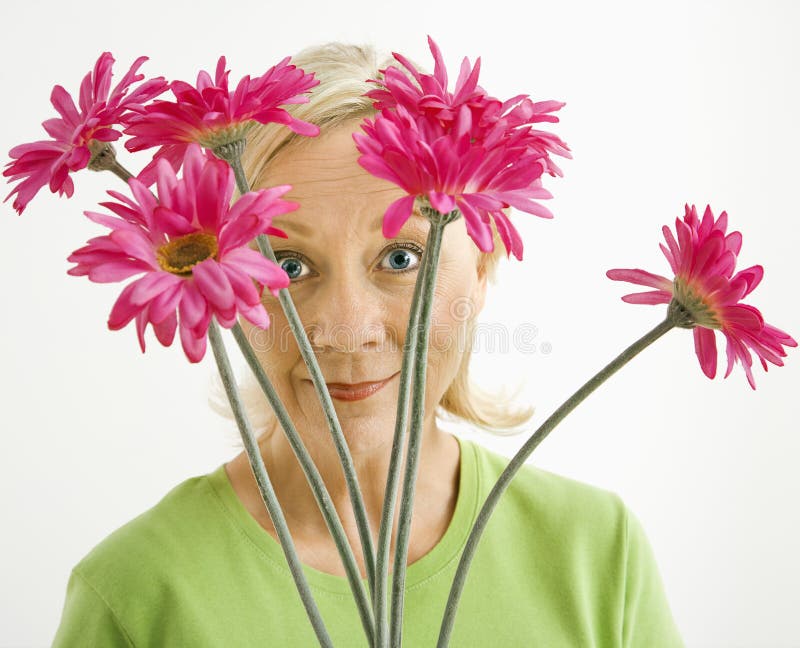 Woman Looking through Flowers. Stock Image - Image of attractive ...