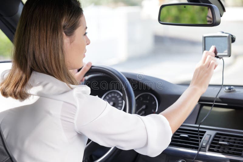 Woman Looking at Gps on Car Stock Image - Image of happy, location ...