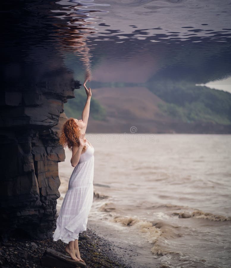 Woman Looking at Her Reflection. Stock Photo - Image of beach, horizon ...