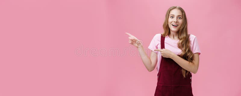 Woman Looking With Impressed And Amazed Look Showing Cool Think On Left