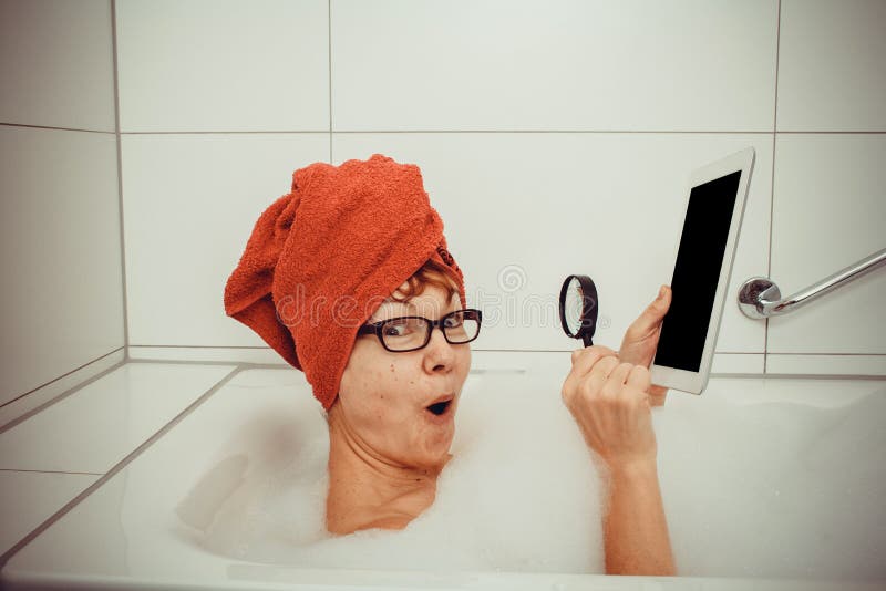 Woman Looking with Magnifying Glass in Tablet Computer Stock Image ...