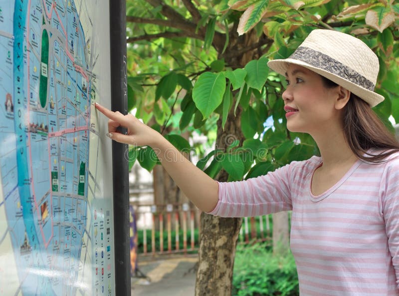 Woman looking the map stock image. Image of destination - 50038277
