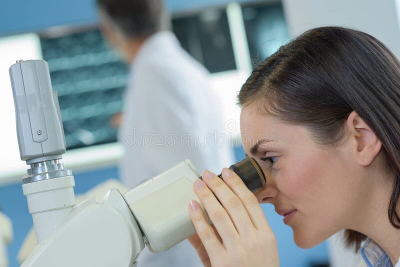 Woman Looking into Microscope Stock Photo - Image of microscope ...