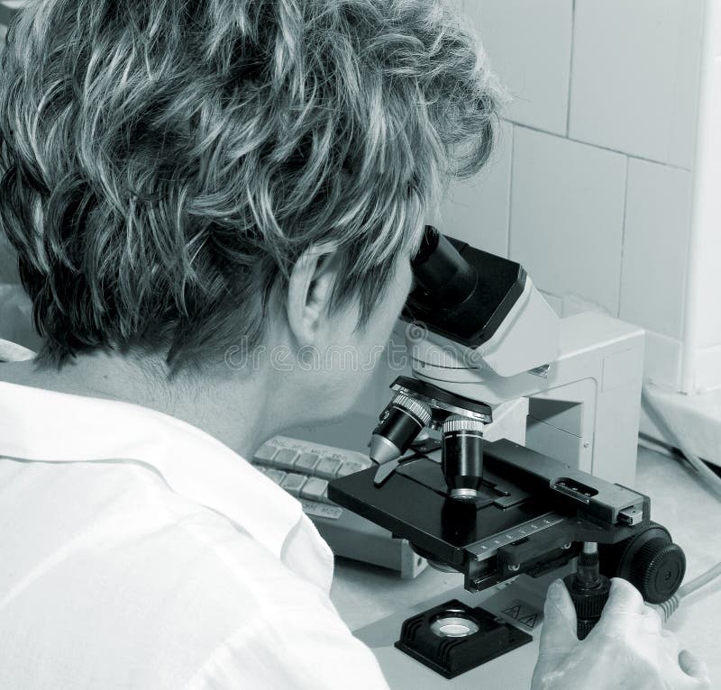 Woman Looking in Microscope Stock Image - Image of hand, adjust: 2382653