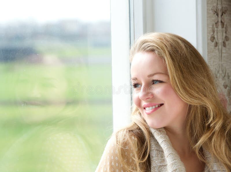 Woman Looking Outside through Window Stock Photo - Image of indoors ...