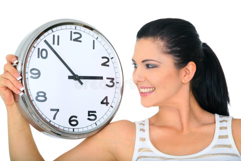 Woman Looking Over Clock stock image. Image of brunette - 12680087