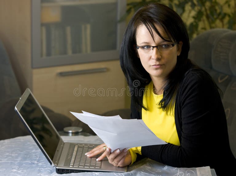 Woman Looking Over Paperwork Stock Photo - Image of bill, working: 7711720