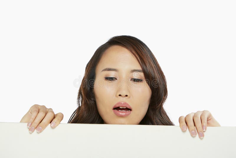 Woman looking over a wall stock photo. Image of creativity - 186230398