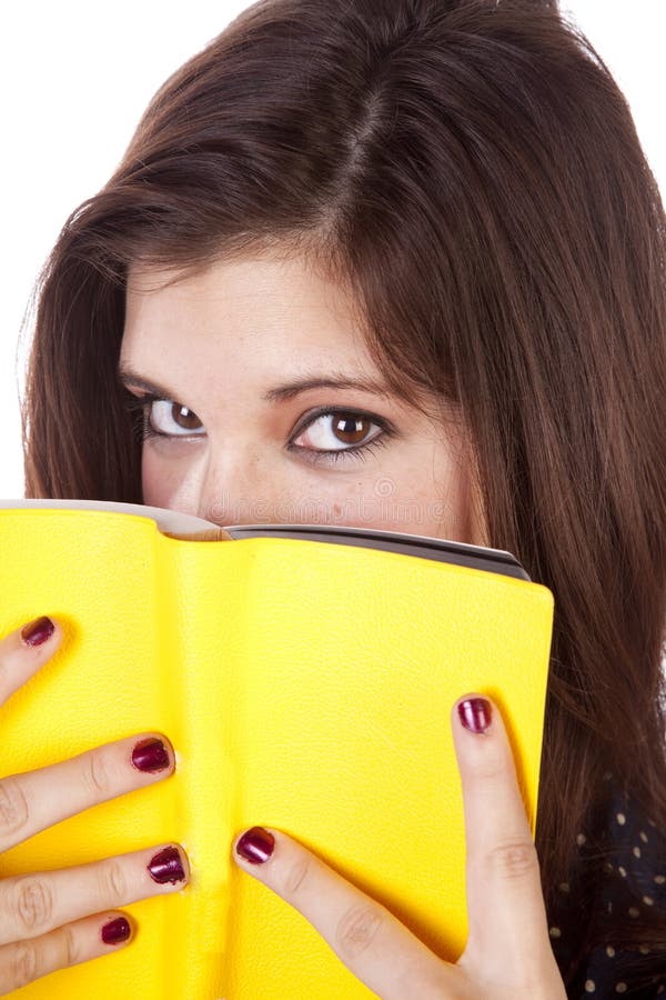 Woman Looking Over Yellow Book Stock Photo - Image of leisure ...
