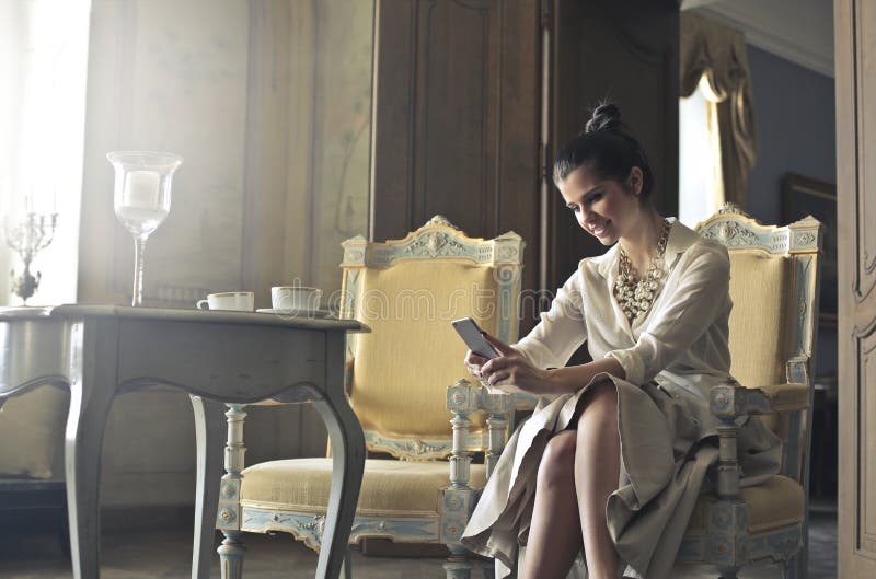 Woman looking at phone stock image. Image of beautiful - 67515689