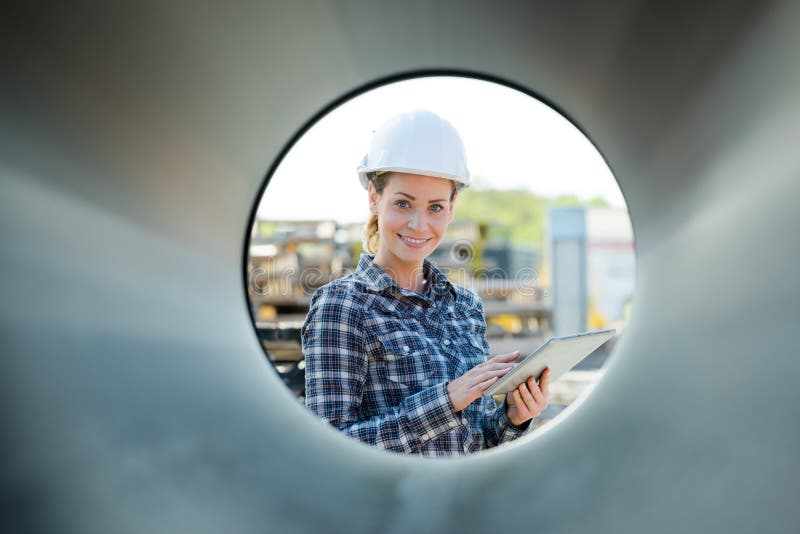 Woman looking through pipe stock photo. Image of garden - 173083130