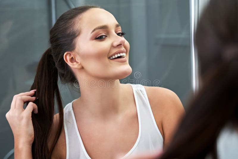 Woman Looking on Reflection in the Mirror after Shower Stock Photo ...