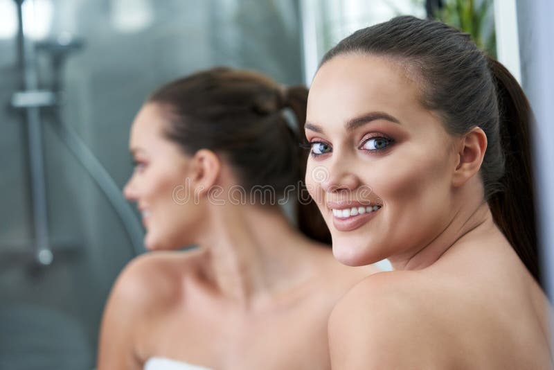 Woman Looking on Reflection in the Mirror after Shower Stock Photo ...