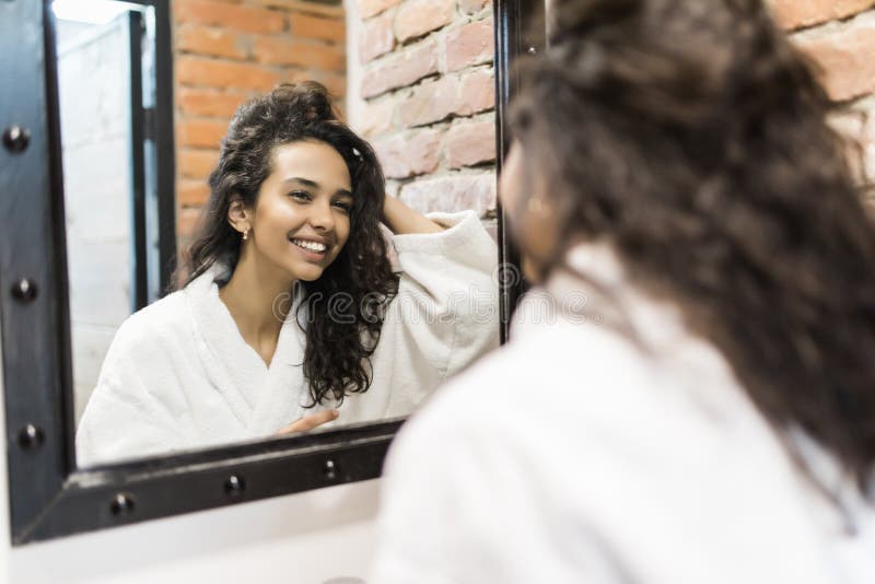Young Woman Looking on Reflection in the Mirror after Shower Stock ...