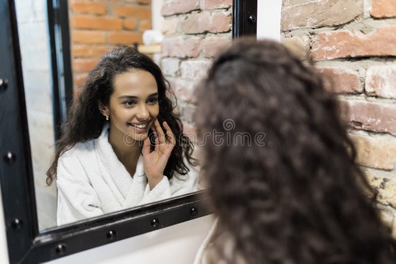 Young Woman Looking on Reflection in the Mirror after Shower Stock ...