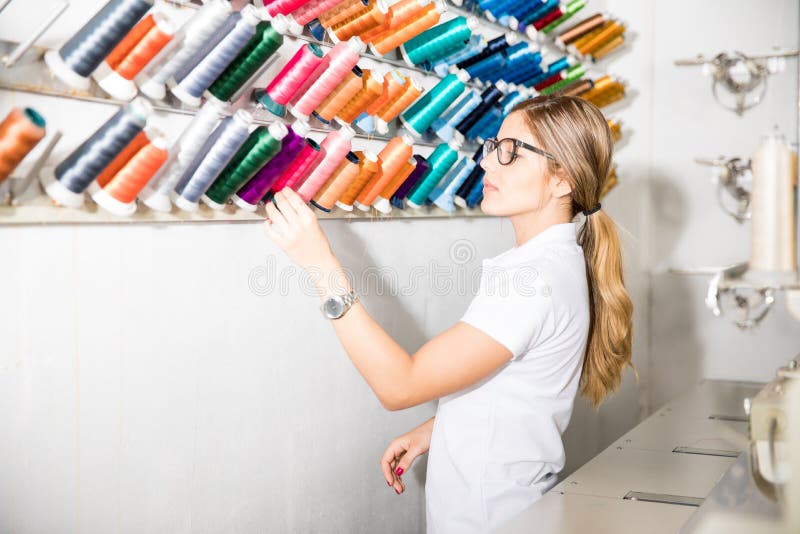 Woman Looking for the Right Thread Roll Stock Photo - Image of female ...
