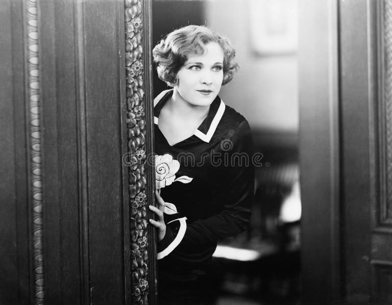 Woman looking into a room stock photo. Image of happiness - 52014730