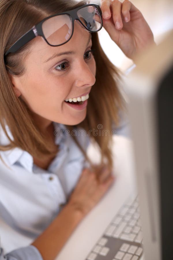 Woman Looking at Screen with Surprised Look Stock Image - Image of ...