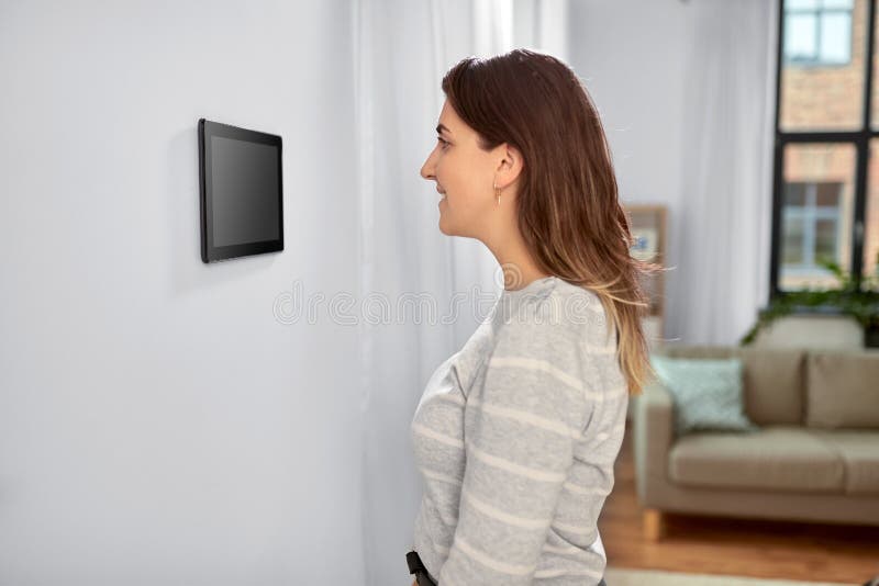 Woman Looking at Tablet Computer at Smart Home Stock Image - Image of ...