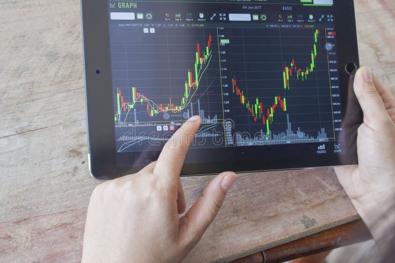 Woman Looking Tablet for Number Trader Stock and Record on Notebook ...