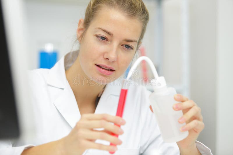 Woman Looking at Test Tube in Lab Stock Photo - Image of test ...
